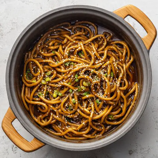 Sweet and Savory Stir-Fried Noodles with Sesame Seeds